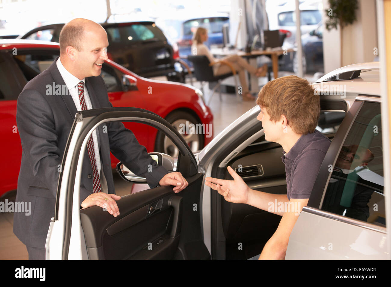 Young man buying new car Stock Photo - Alamy