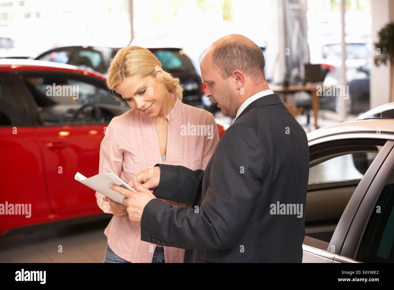 Woman buying new car Stock Photo - Alamy