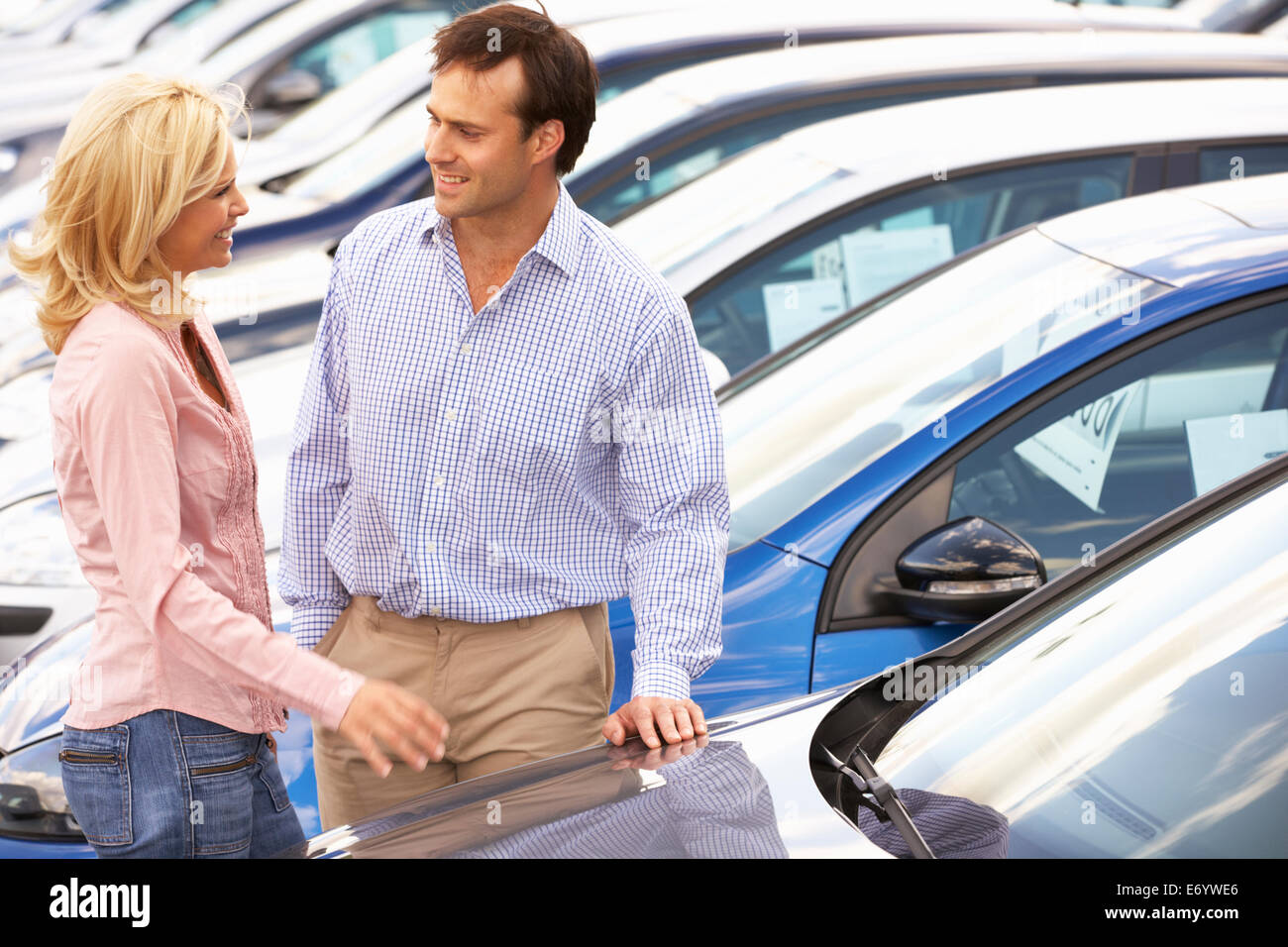 Couple buying new car Stock Photo - Alamy