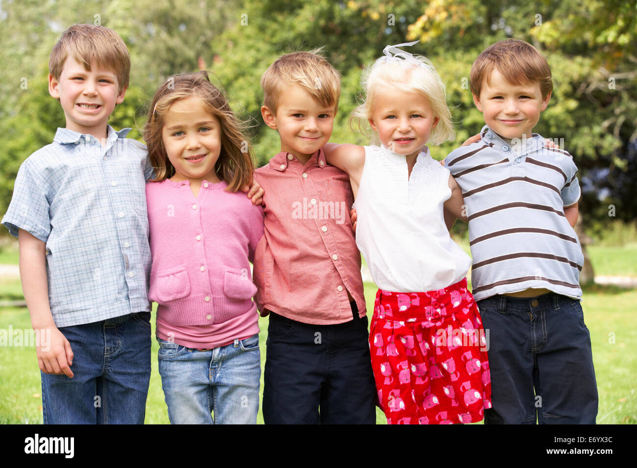 Portrait small group young children in park Stock Photo - Alamy