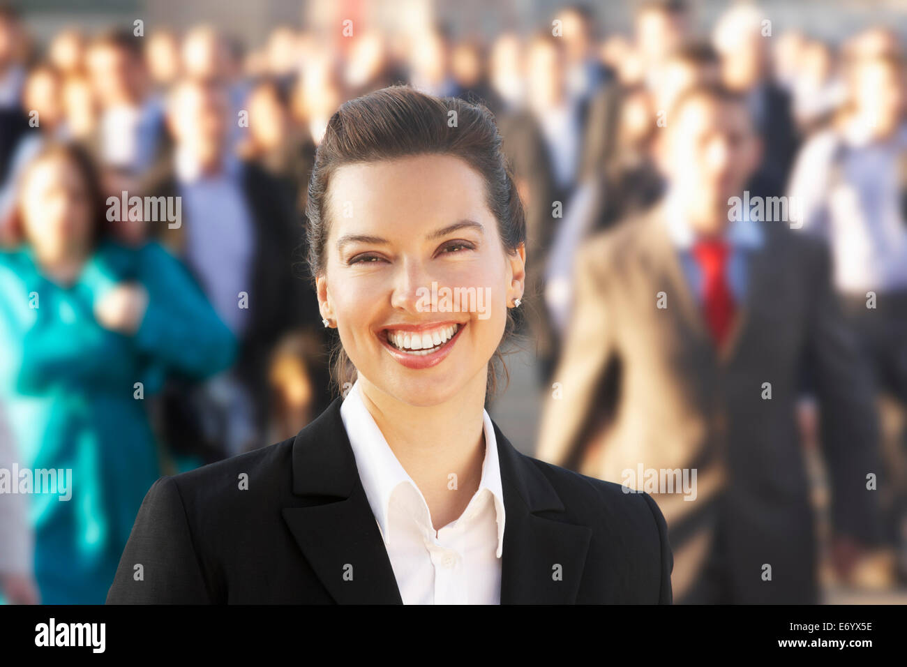 Female commuter in crowd Stock Photo - Alamy