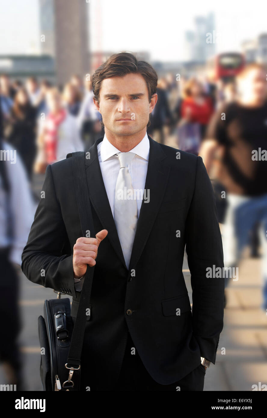 Male commuter in crowd Stock Photo - Alamy