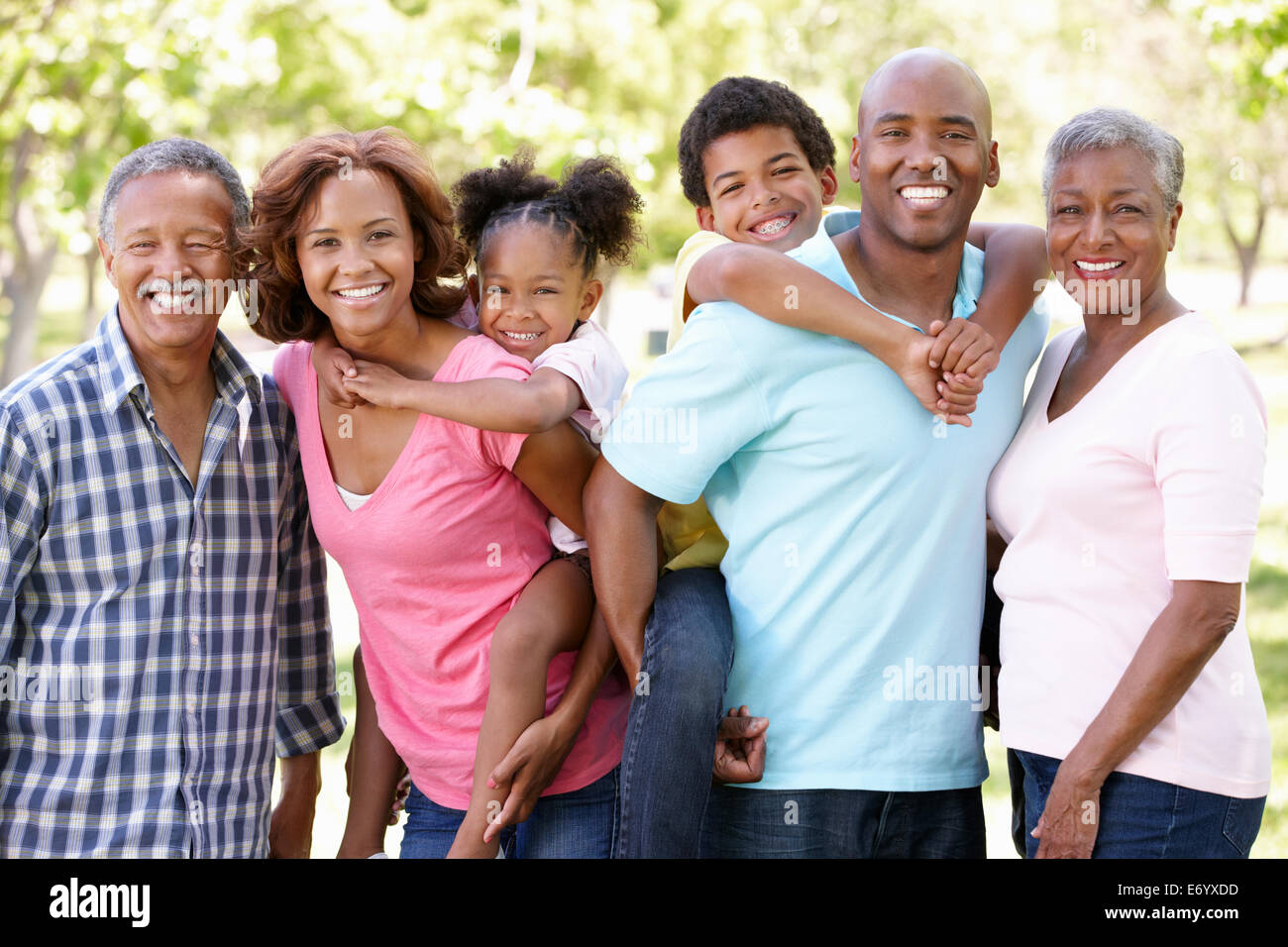 Multi-generation family in park Stock Photo - Alamy