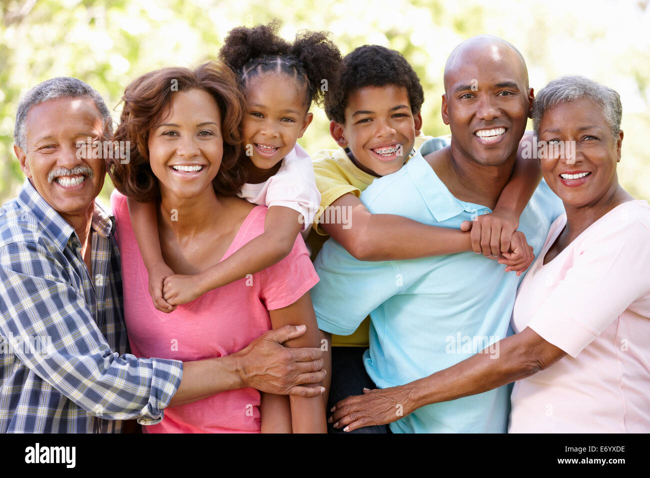 Multi-generation family in park Stock Photo - Alamy