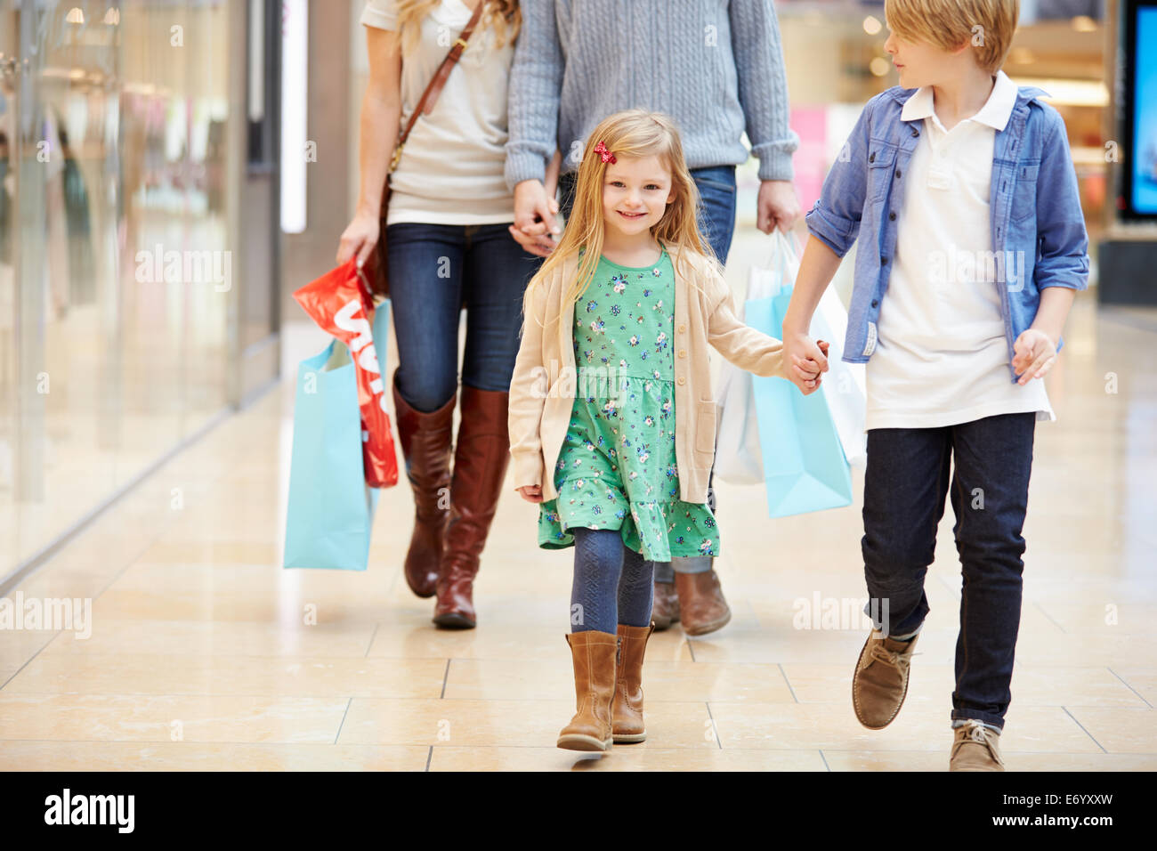Children On Trip To Shopping Mall With Parents Stock Photo - Alamy