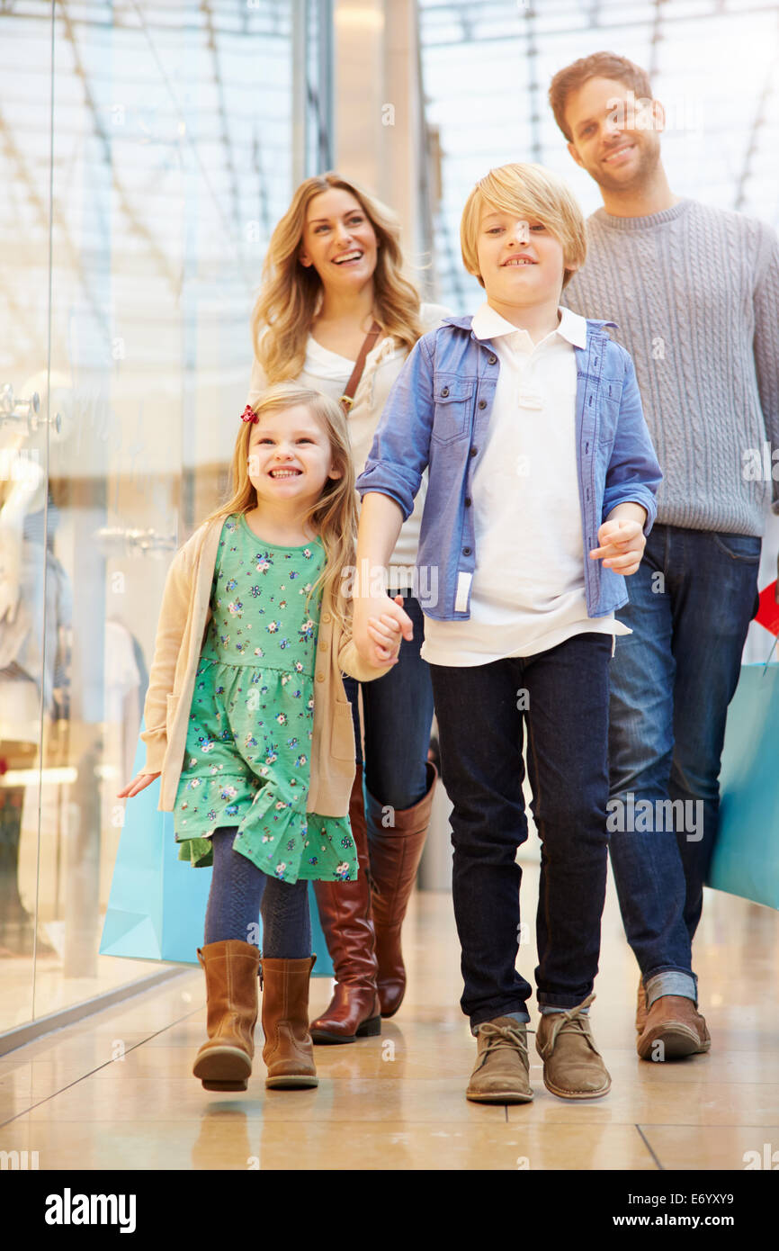Child holding hands parents mall hi-res stock photography and images ...