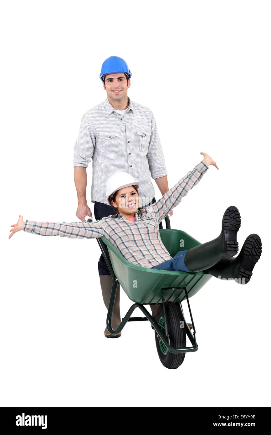 Wheelbarrow people transport Cut Out Stock Images & Pictures - Alamy