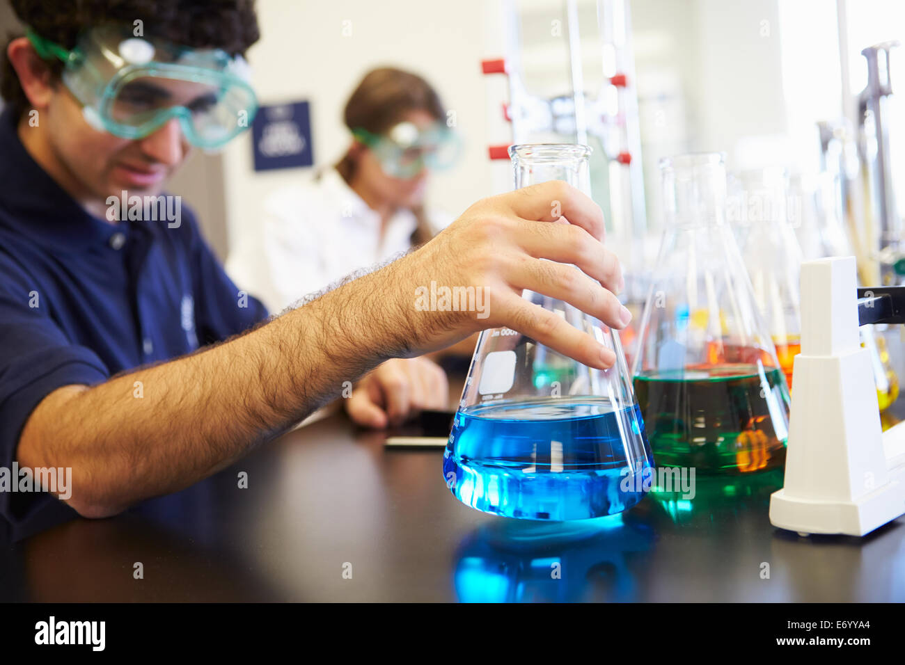 Pupils Carrying Out Experiment In Science Class Stock Photo - Alamy