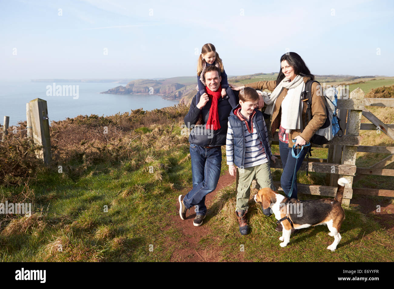 Smiling family walking along path hi-res stock photography and images ...