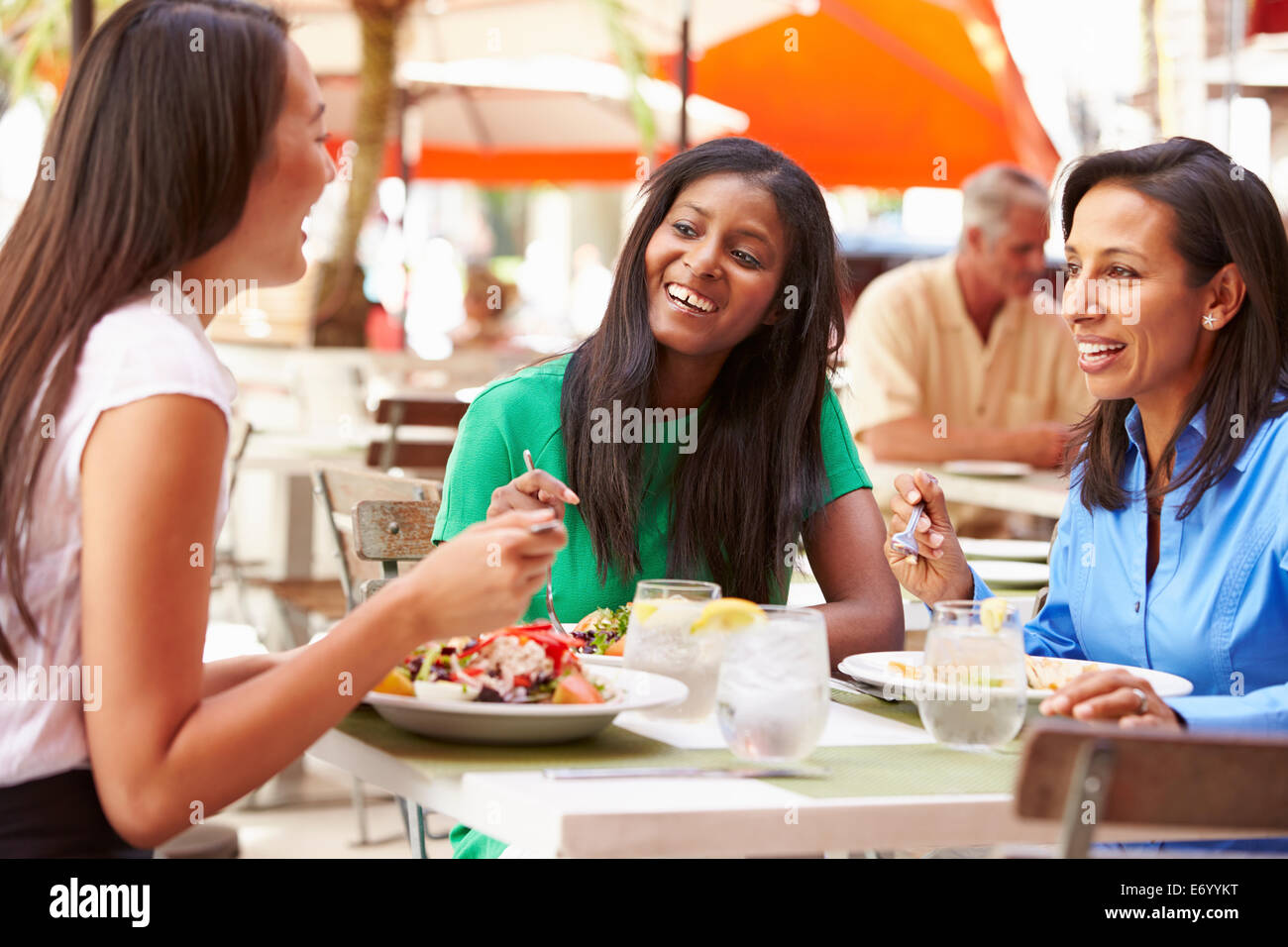 Group Of Female Friends Enjoying Lunch In Outdoor Restaurant Stock ...