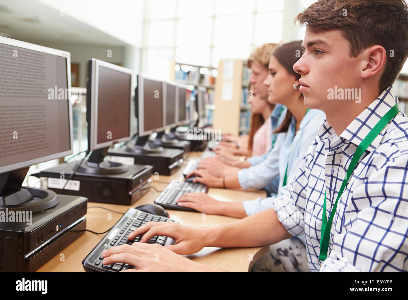 Group Of Students Working At Computers In Library Stock Photo - Alamy
