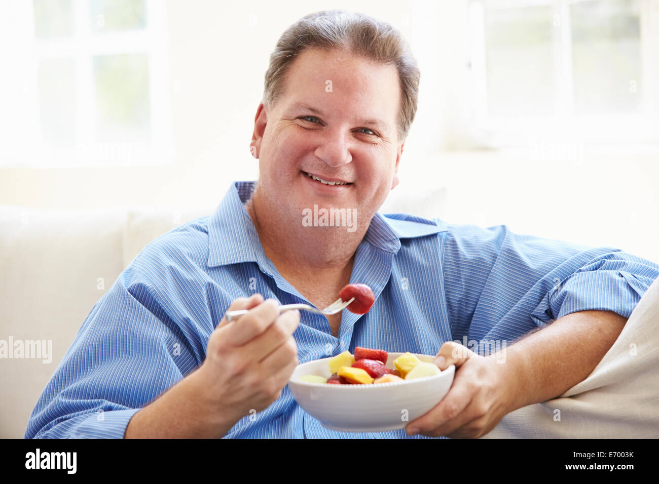 Obese man eating hi-res stock photography and images - Alamy