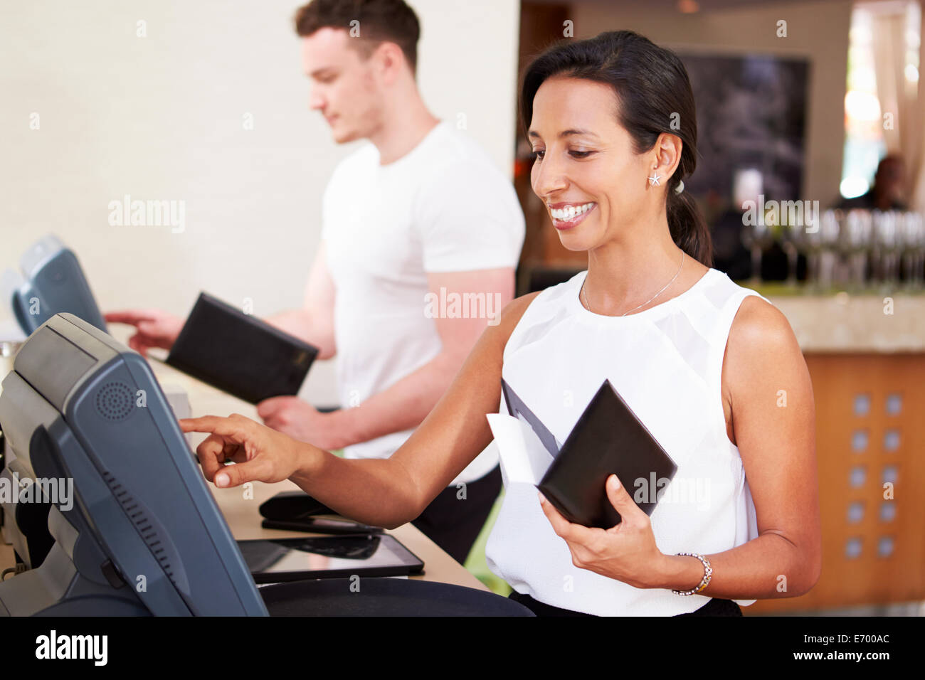 Waitress waiter in restaurant hi-res stock photography and images - Alamy