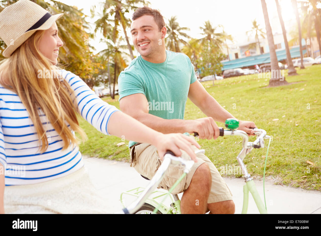 Young Couple Having Fun On Bicycle Ride Stock Photo - Alamy