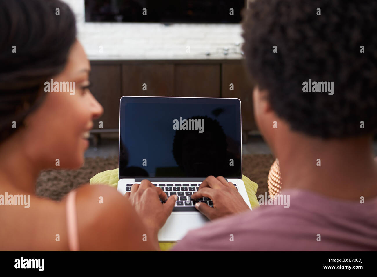 Rear view sitting at computer hi-res stock photography and images - Alamy