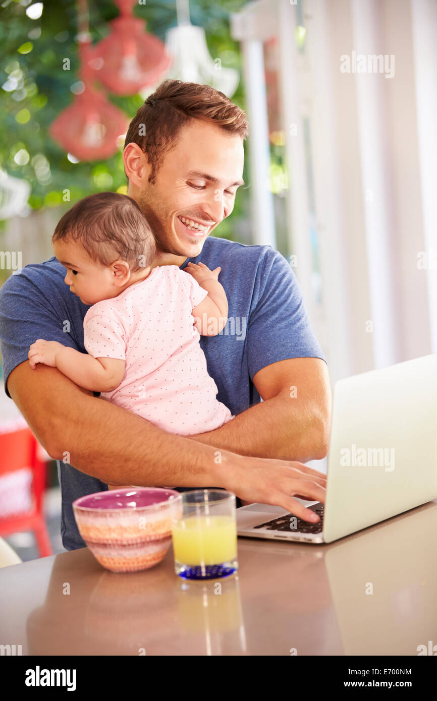 Father multi tasking using hi-res stock photography and images - Alamy