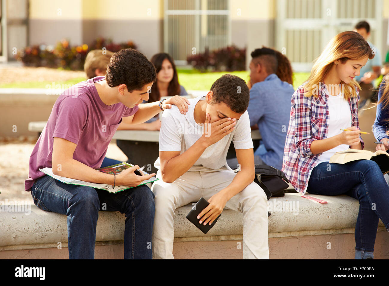 Group friends outdoors school unhappy hi-res stock photography and ...