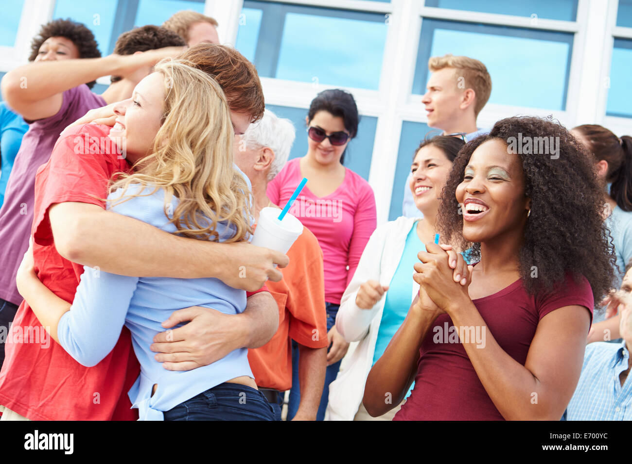 Spectators Celebrating At Outdoor Sports Event Stock Photo - Alamy