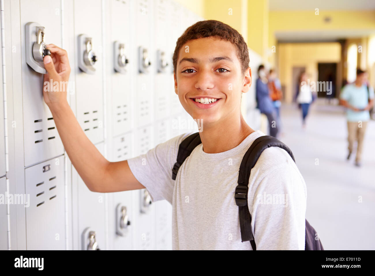 Male High School Student Opening Locker Stock Photo - Alamy