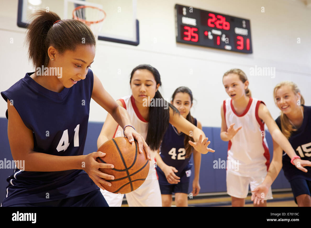 Female High School Basketball Team Playing Game Stock Photo - Alamy