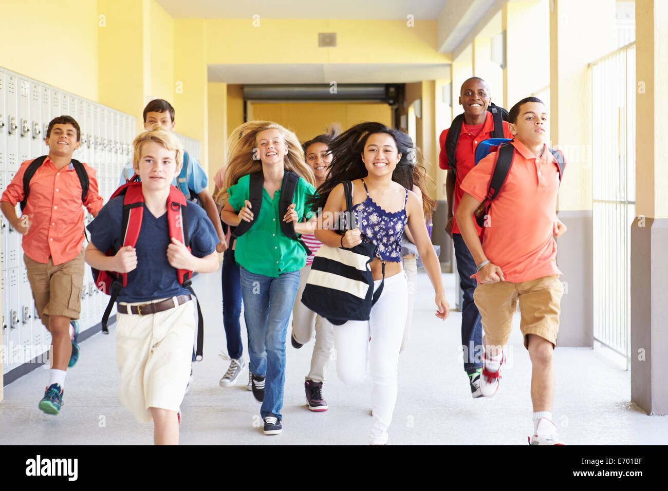 Students running out school hi-res stock photography and images - Alamy