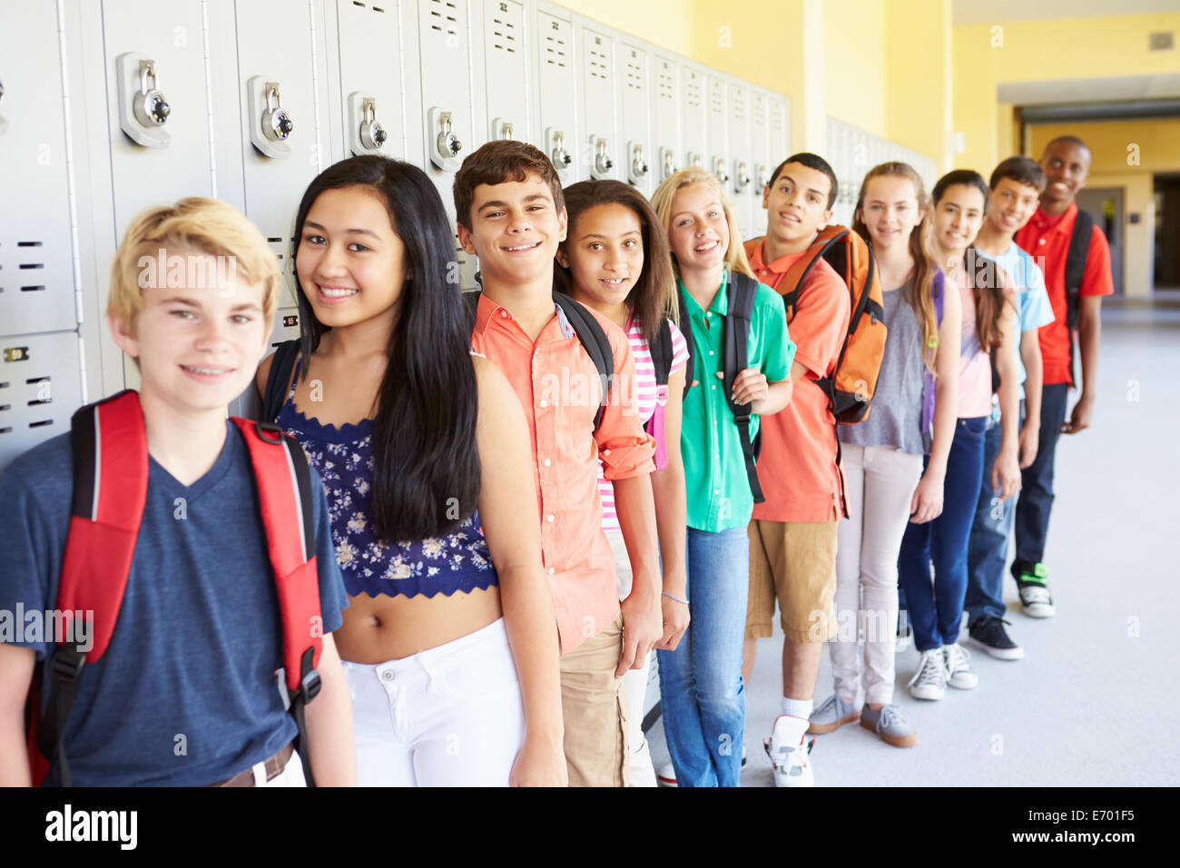 Group Of High School Students Standing In Corridor Stock Photo - Alamy