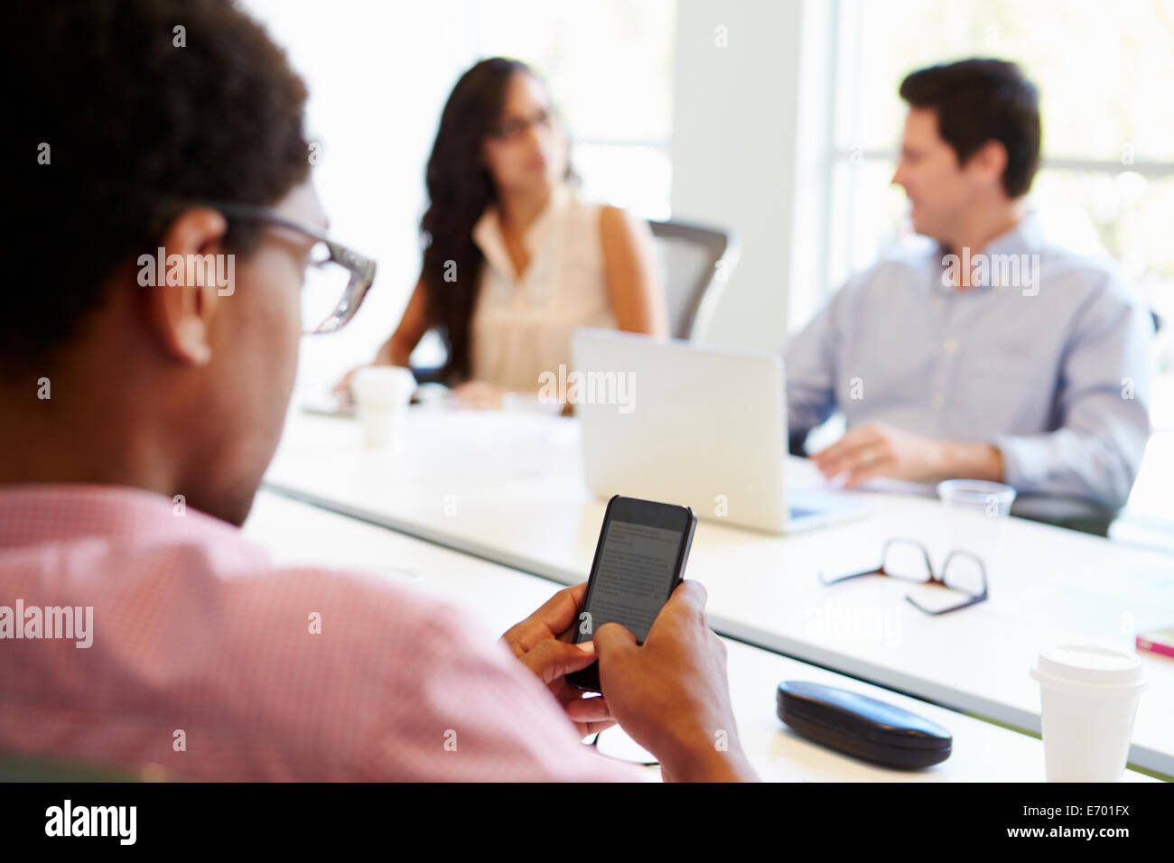 Office mobile phone texting hi-res stock photography and images - Alamy