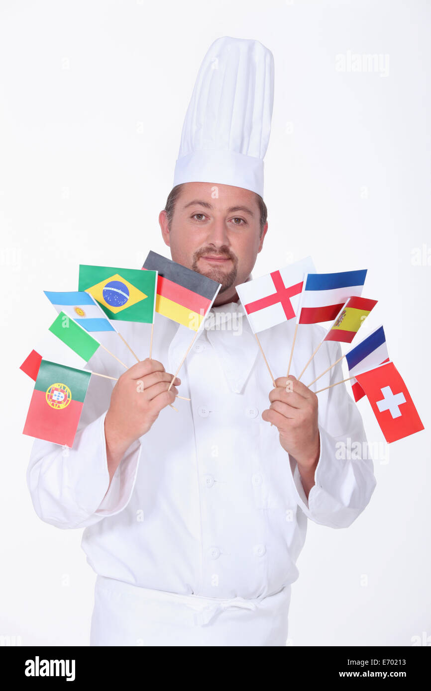 A chef holding a bunch of flags Stock Photo - Alamy