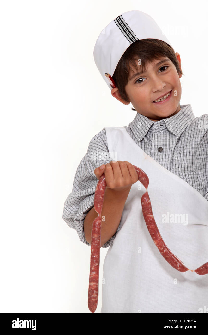 Child dressed as a butcher with a link of sausages Stock Photo - Alamy