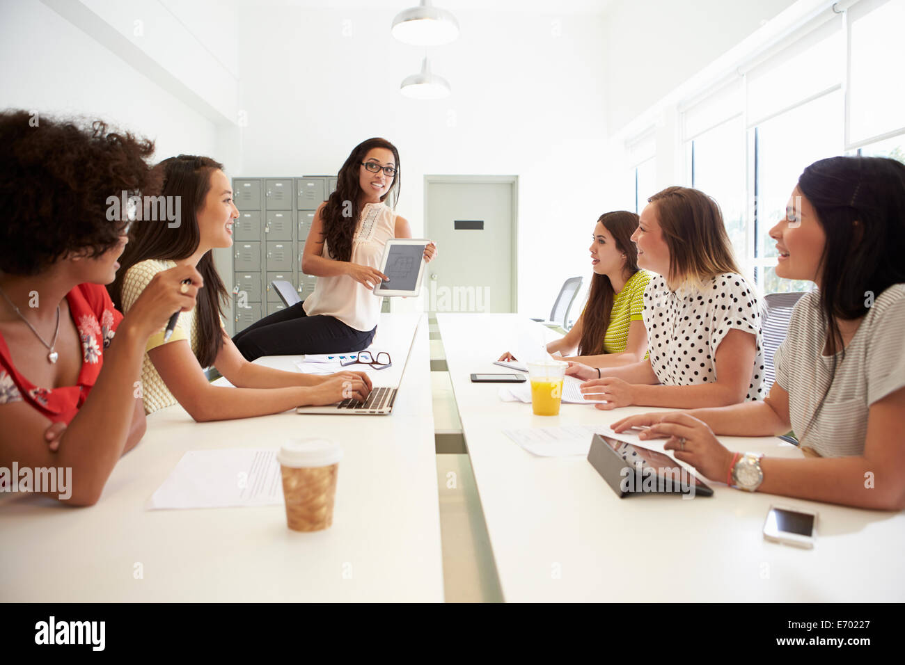 Group Of Women Working Together In Design Studio Stock Photo - Alamy
