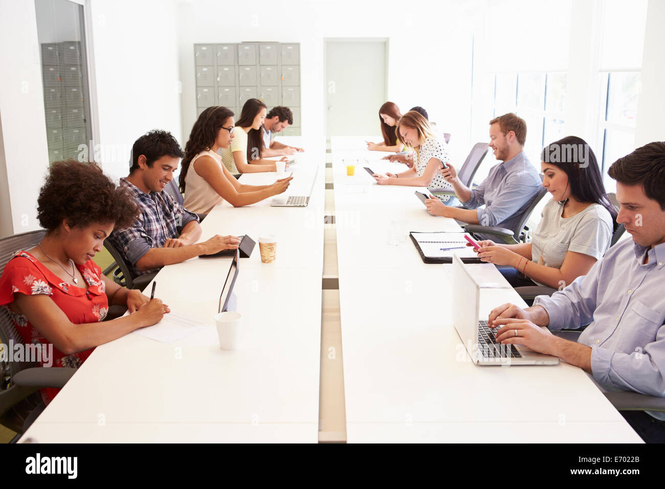 Design Team Collaborating On Project Together Stock Photo - Alamy