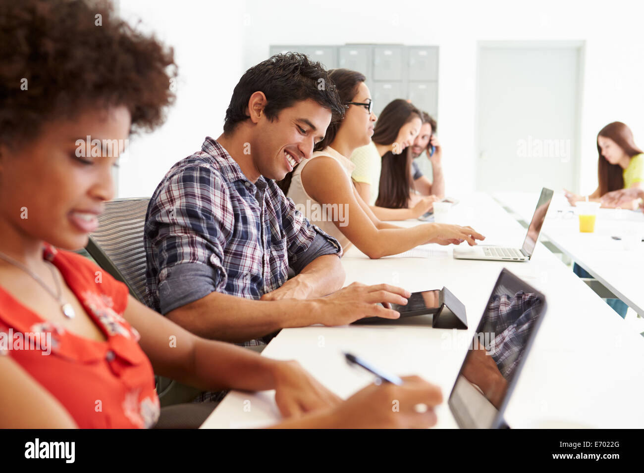 Design Team Collaborating On Project Together Stock Photo - Alamy