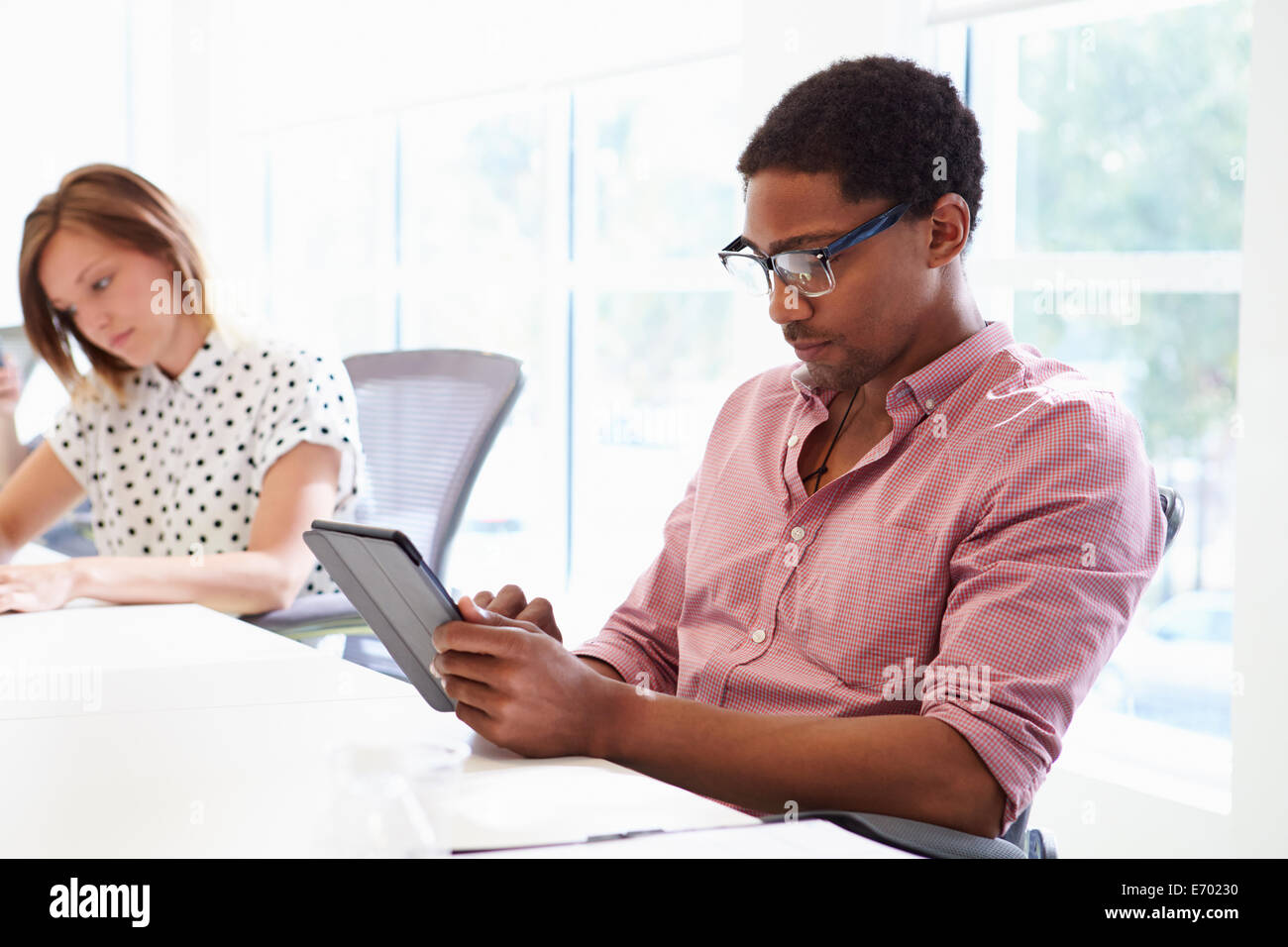 Design Team Collaborating On Project Together Stock Photo - Alamy