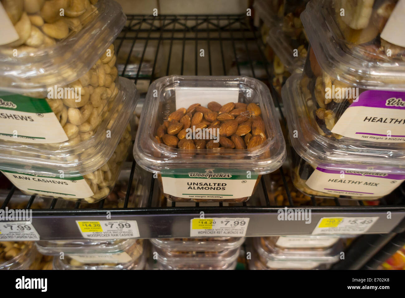A container of almonds and other nuts are seen in a supermarket in New ...