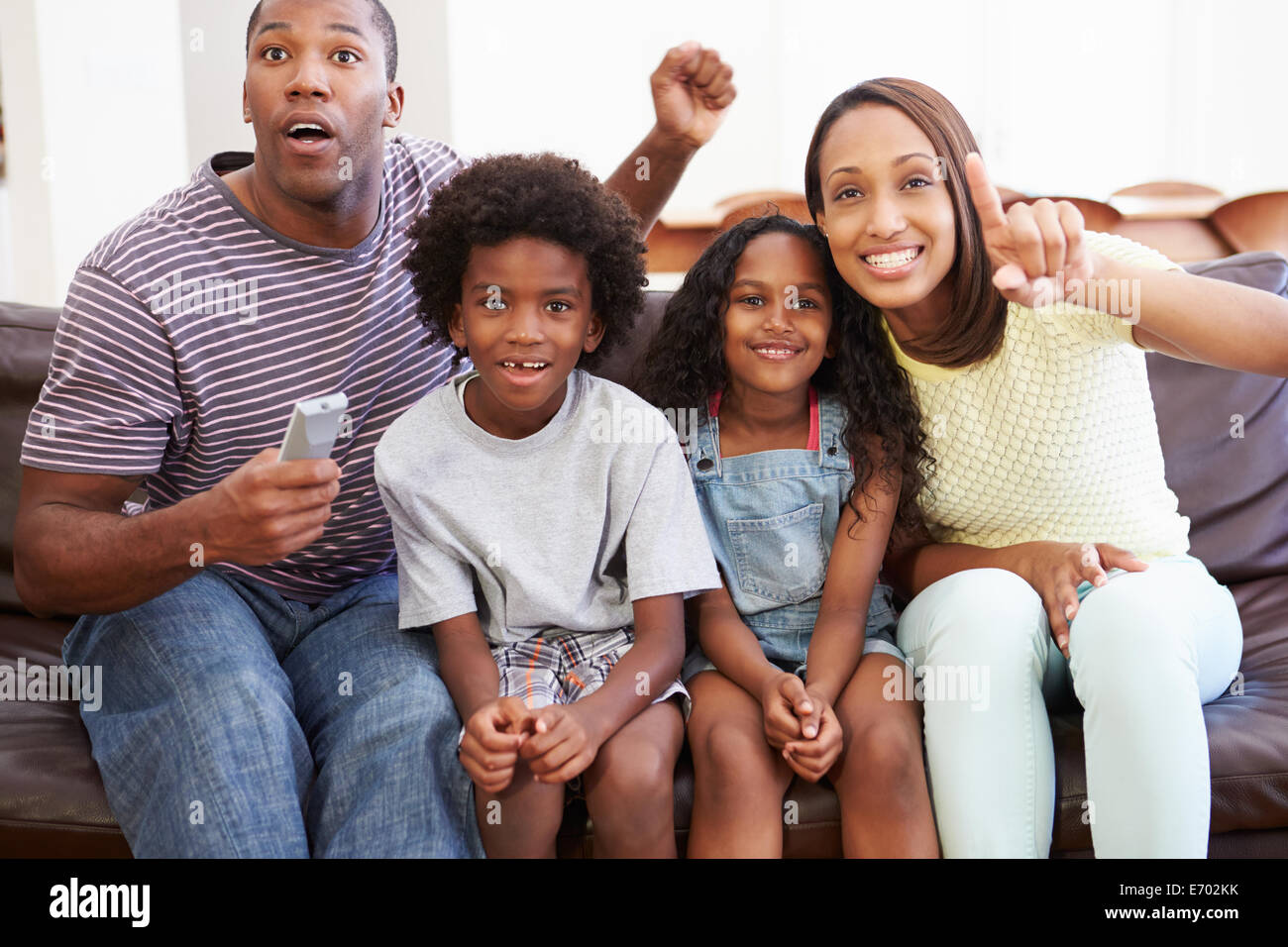 Family watching game cheering hi-res stock photography and images - Alamy