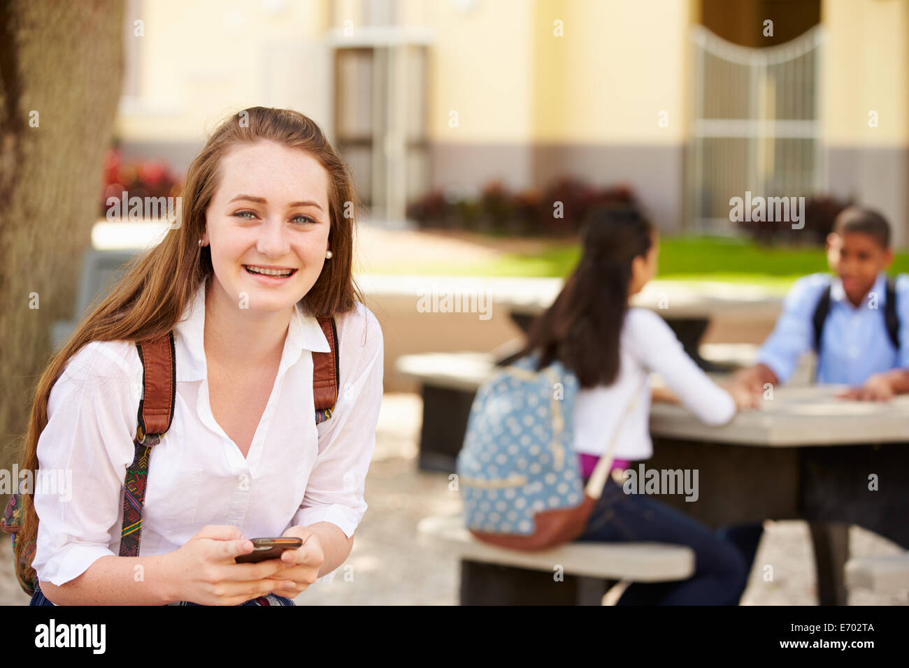 Female High School Student Using Phone On School Campus Stock Photo - Alamy
