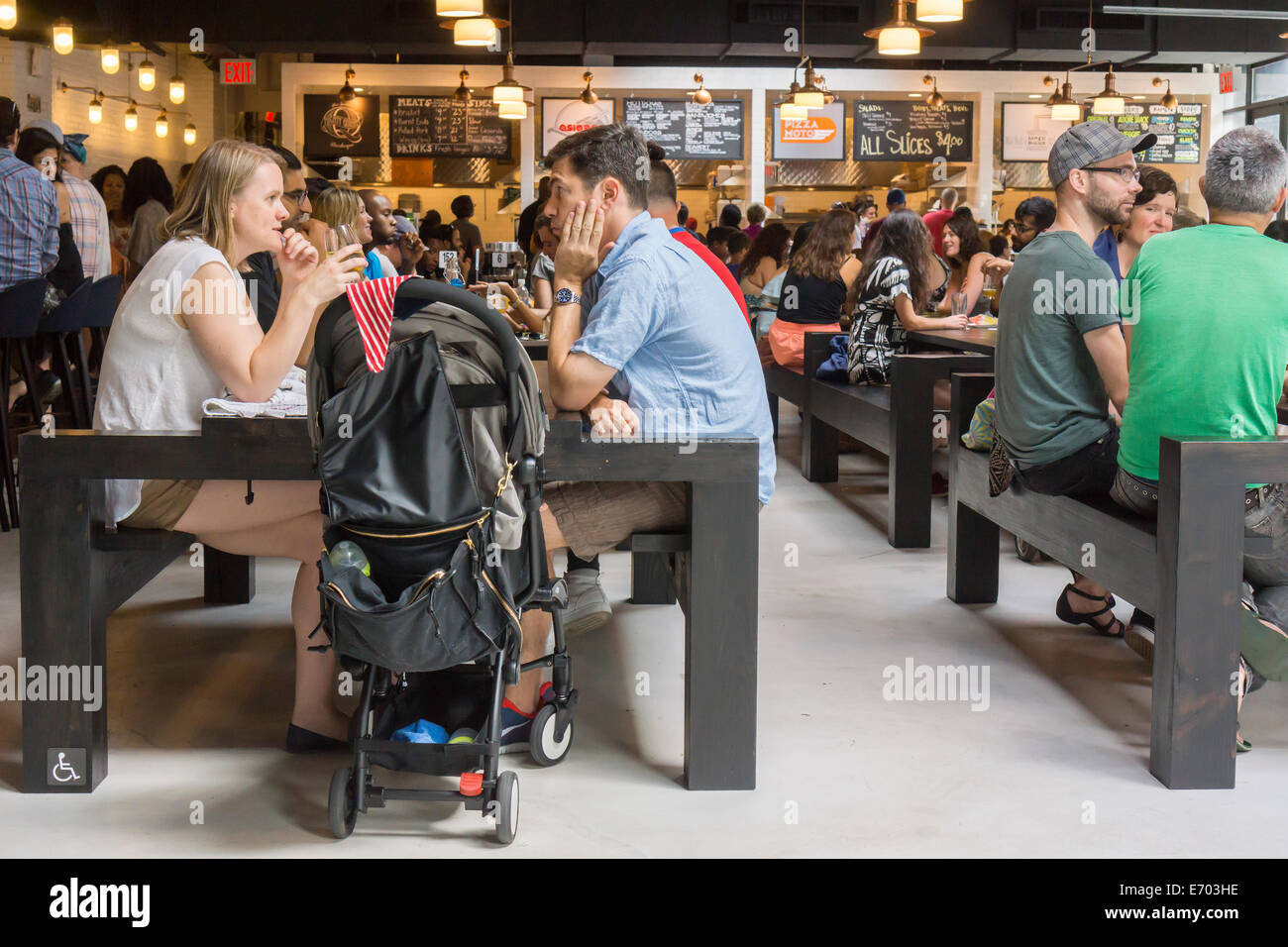 Diners eat at the communal tables in Berg'n a food and beer hall, in ...