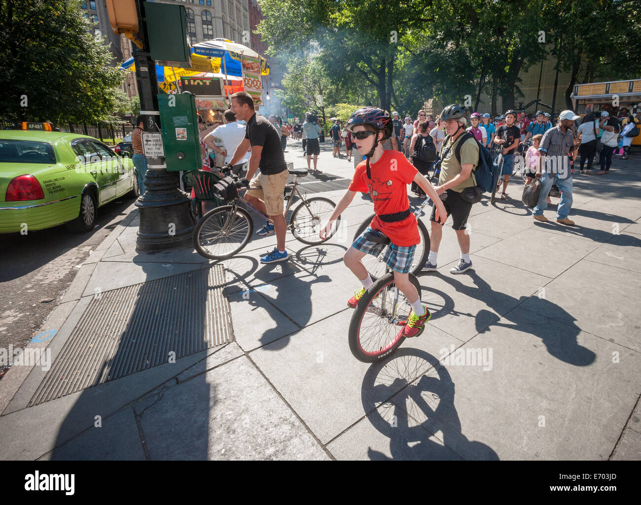 A young unicyclist waits to start the 13-mile ride across the Brooklyn ...