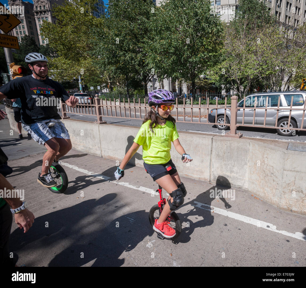 A young unicyclist rides across the Brooklyn Bridge during 13-mile trip ...