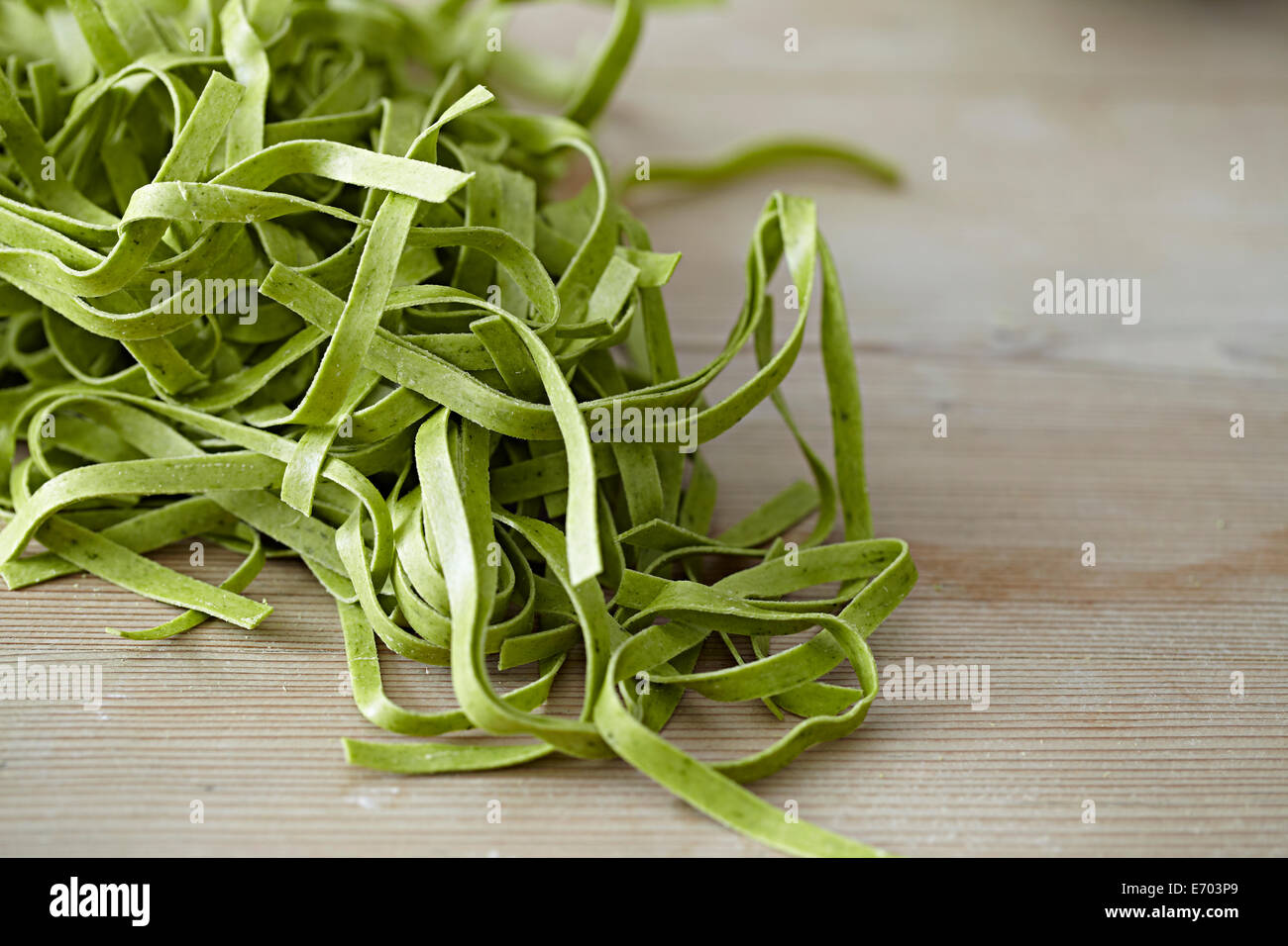 Uncooked tagliatelle pasta Stock Photo - Alamy