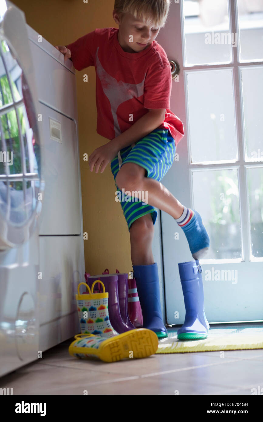 Family putting on boots hi-res stock photography and images - Alamy