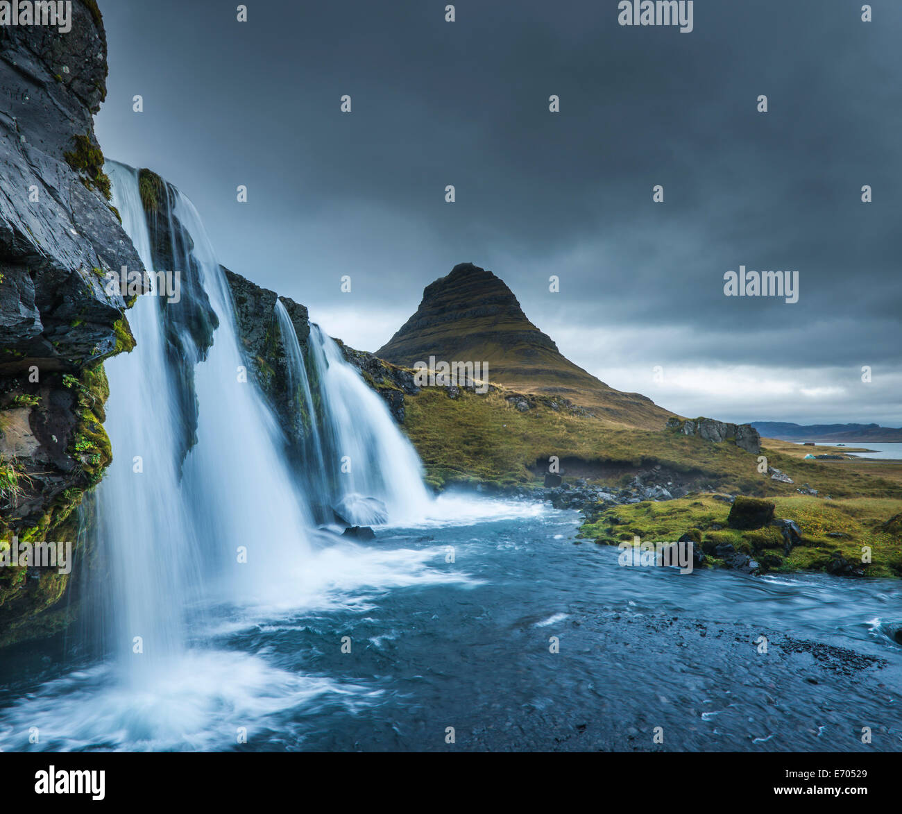 Kirkjufellsfoss waterfall, Mt. Kikjufell in background, Snaefellsnes ...