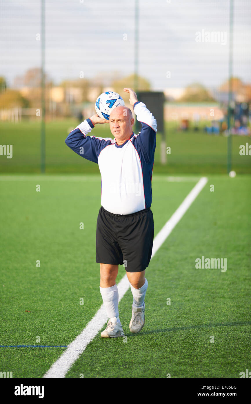 Soccer player throwing ball hi-res stock photography and images - Alamy