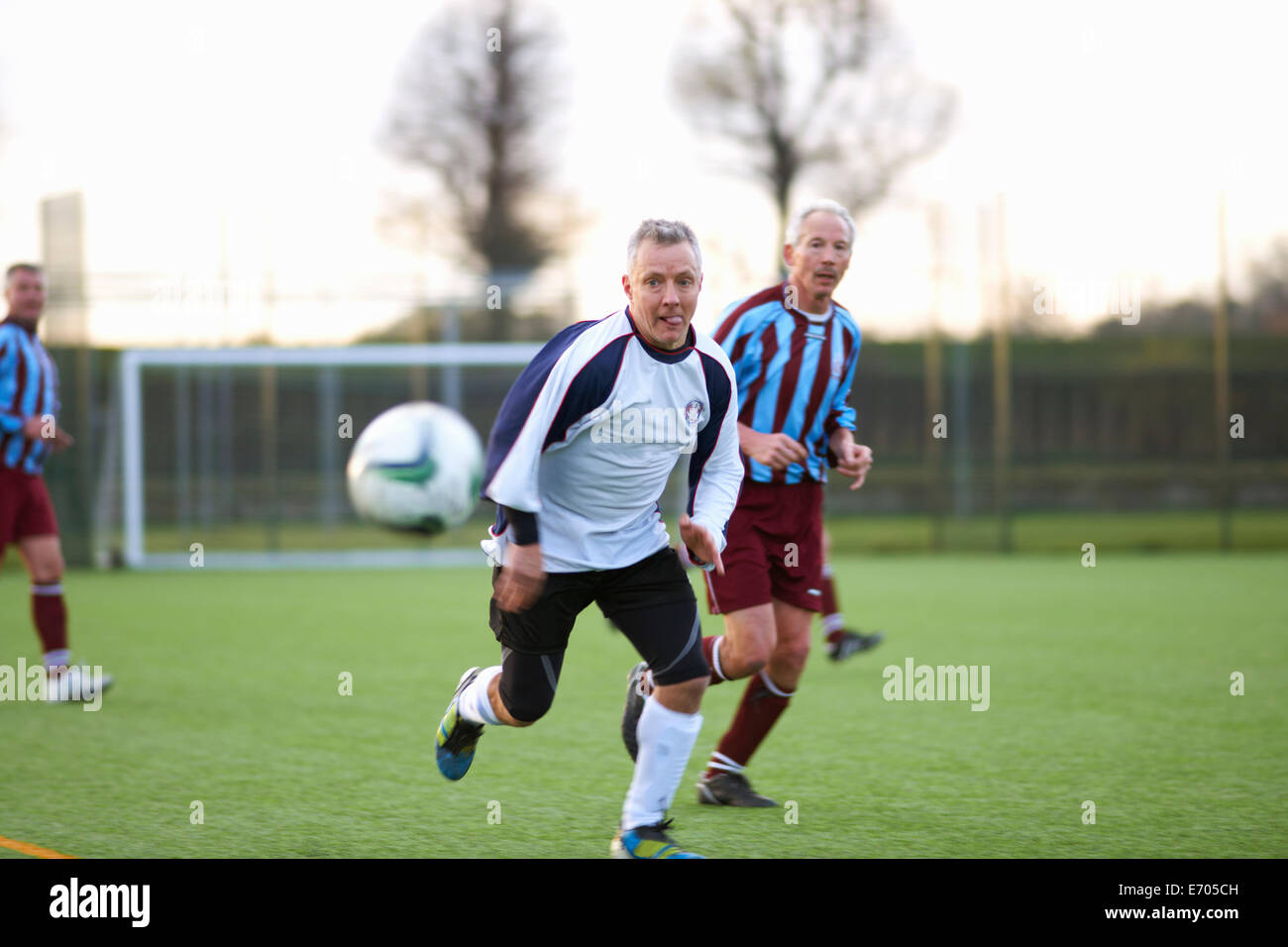 Football players running stadium hi-res stock photography and images ...