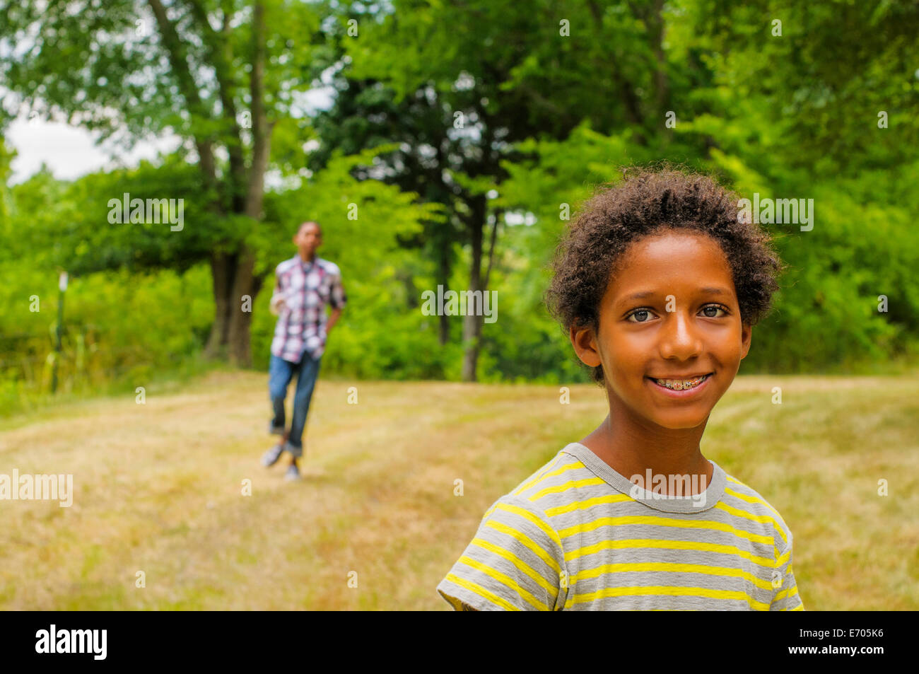 Boys in a forest Stock Photo - Alamy