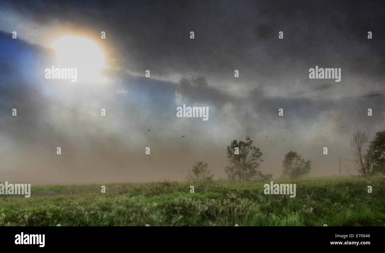 Intense outflow winds from supercell sweep debris into the air. Sun ...