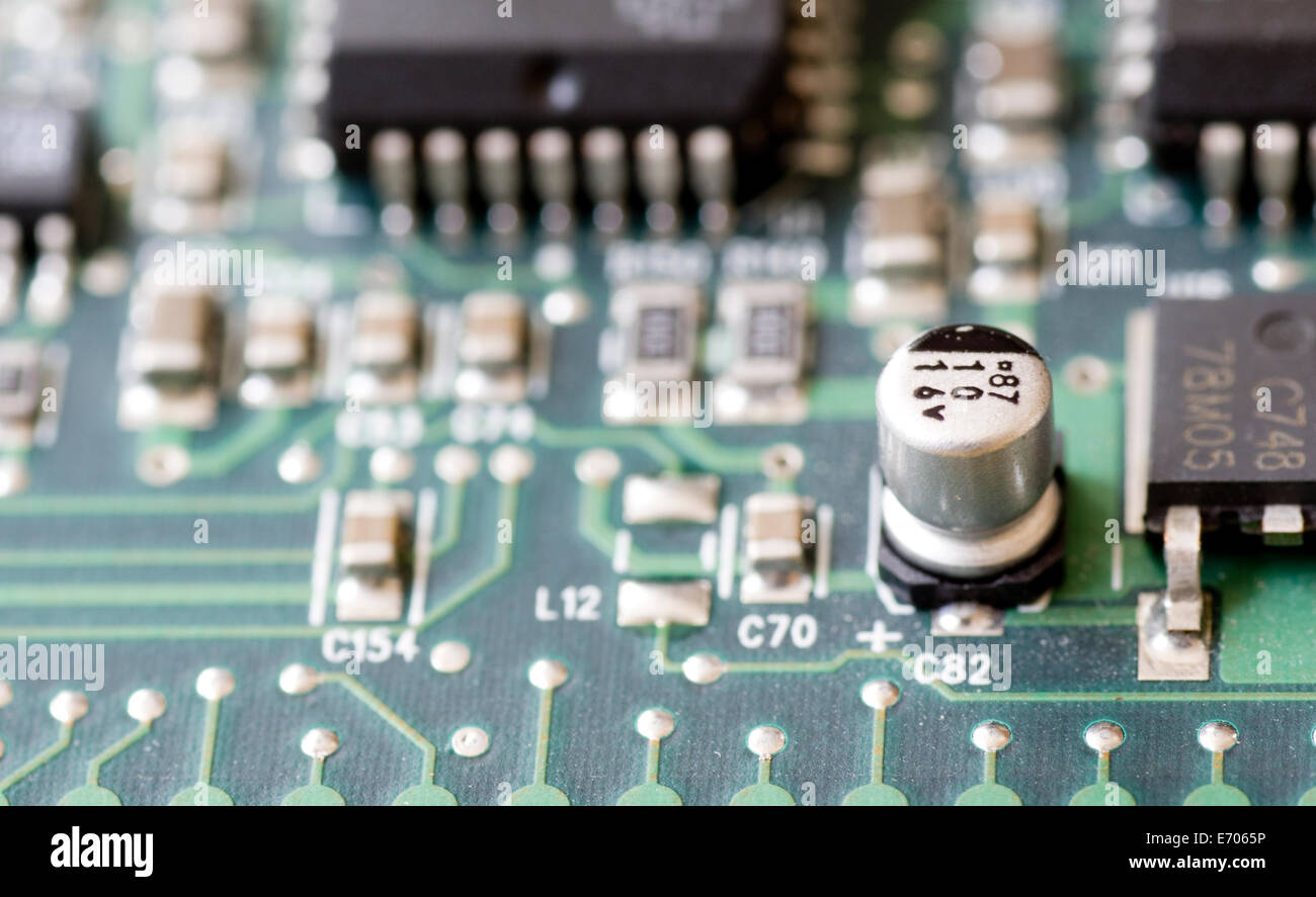 Closeup of a printed circuit board with components such as integrated ...