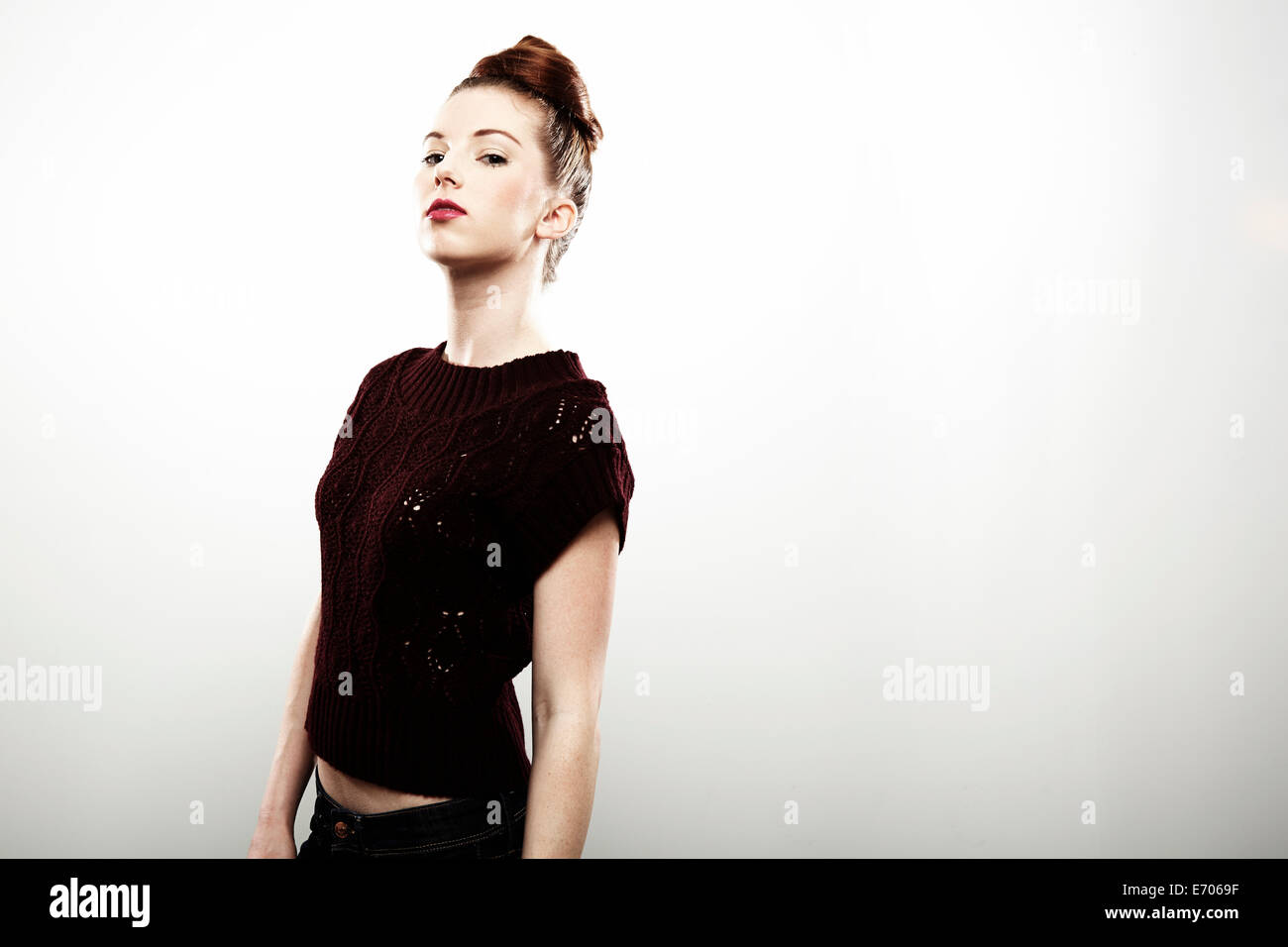 Studio portrait of aloof young woman Stock Photo - Alamy Studio portrait of aloof young woman Stock Photo - Alamy