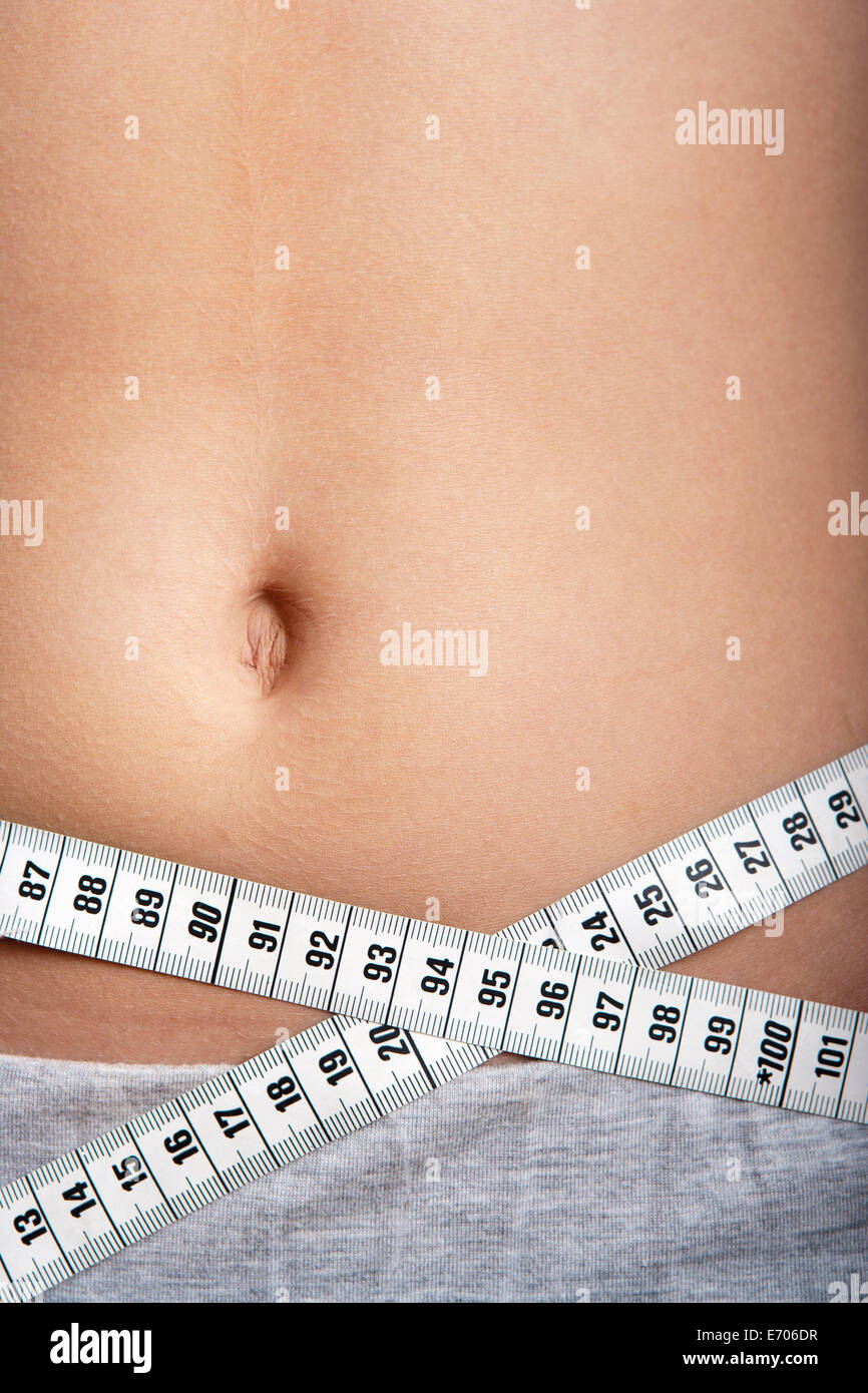 Tape measure around waist Stock Photo - Alamy
