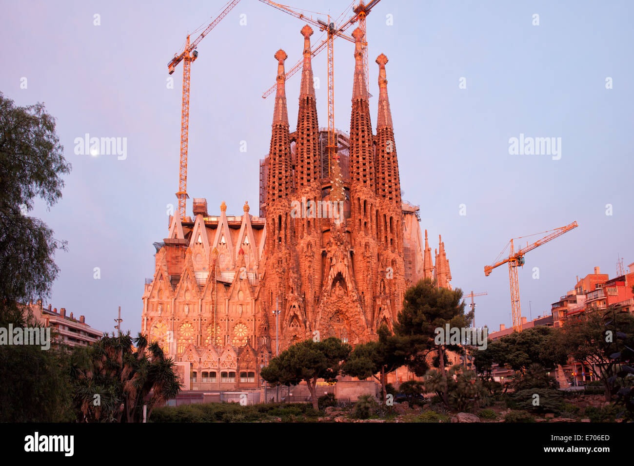 Red sunset on the Nativity Facade of Sagrada Familia by Antoni Gaudi in ...